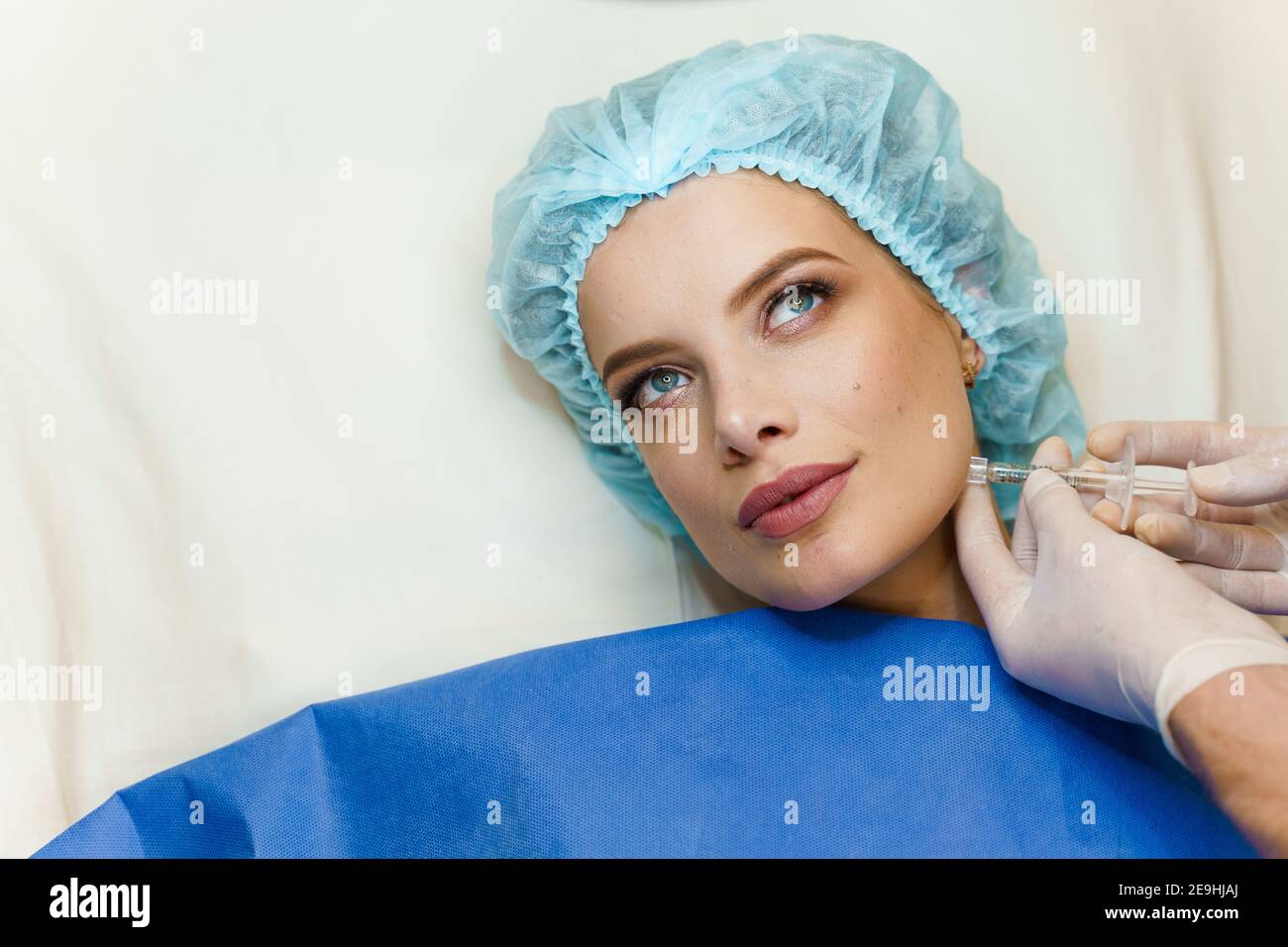 Filler injection in cheekbones. ?ontour plastic for correcting the ...