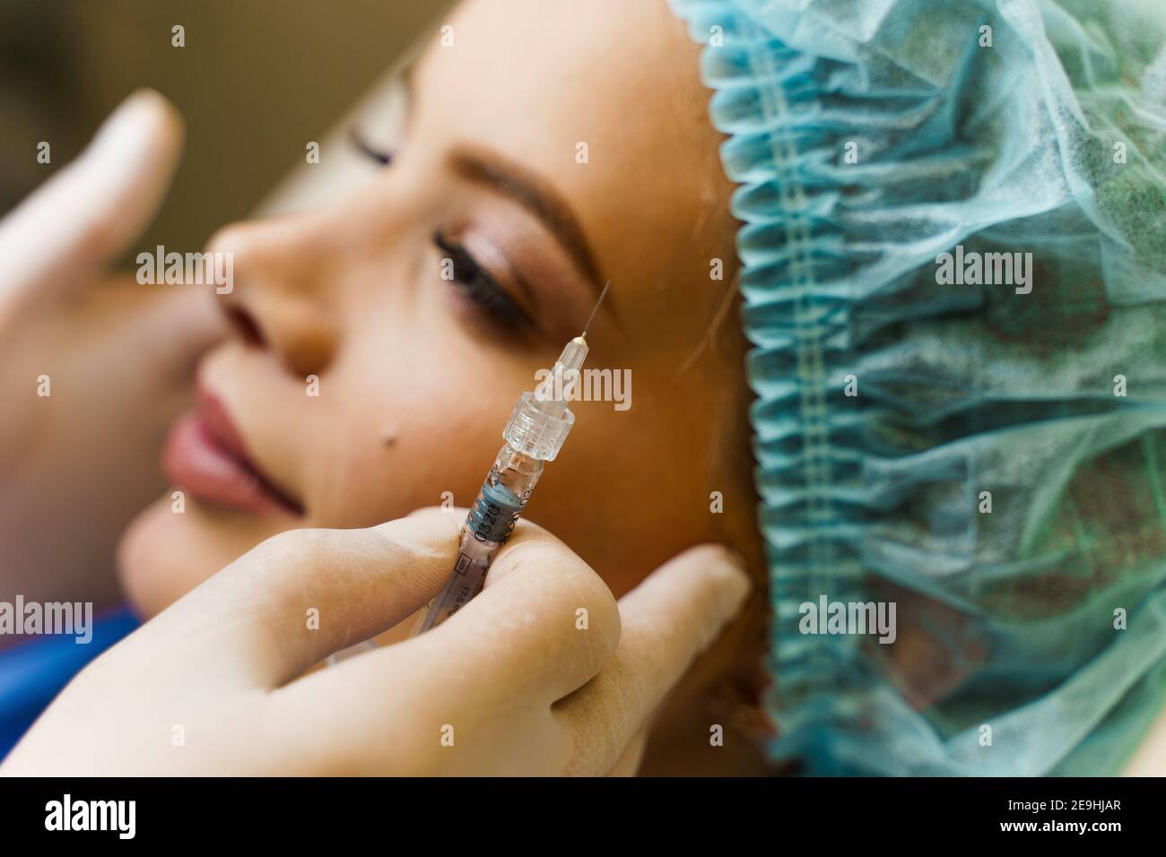 Close-up filler injection in cheekbones. ?ontour plastic for correcting ...
