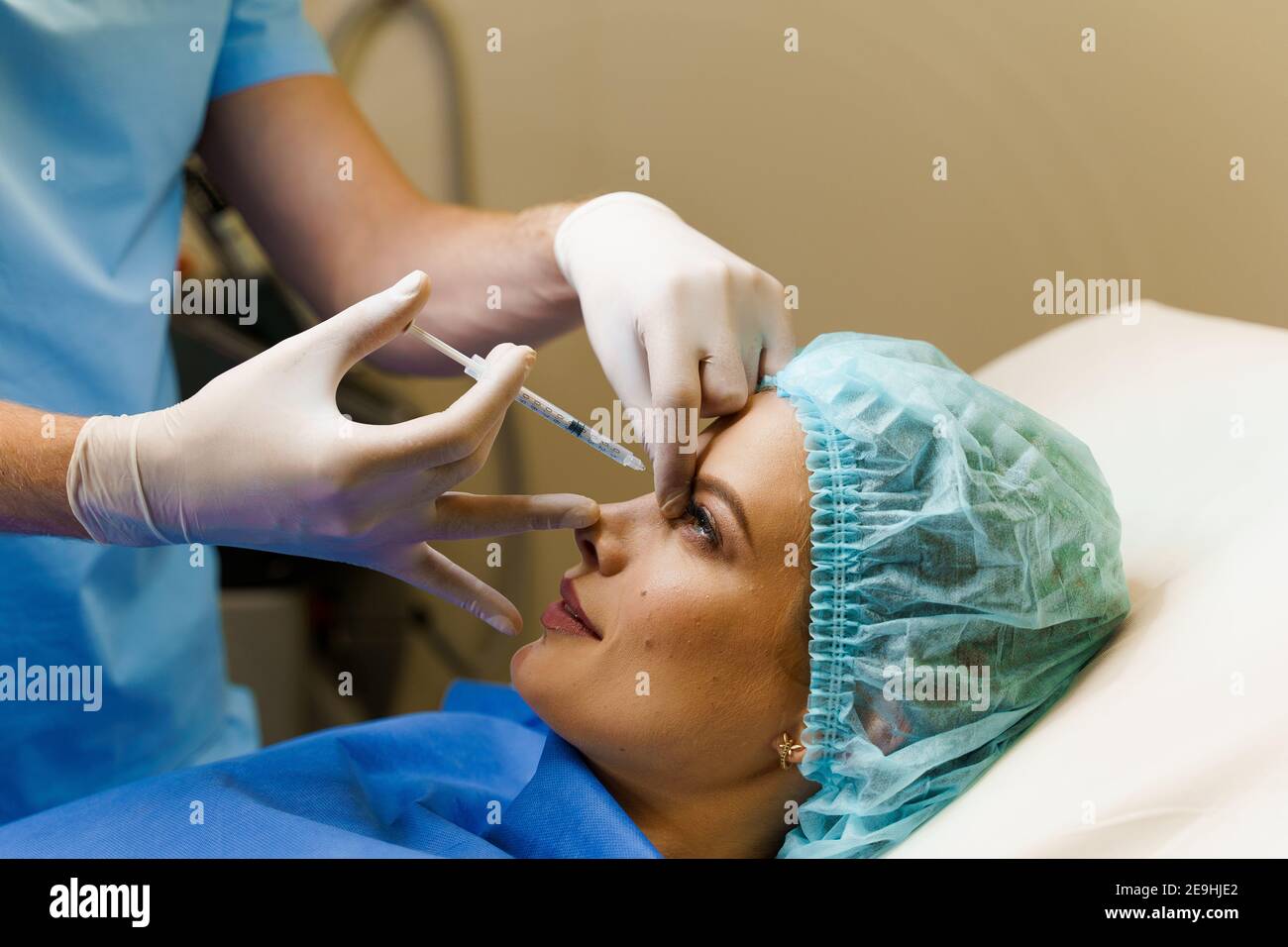 Injection in forehead contour plastic for correcting the volume and ...