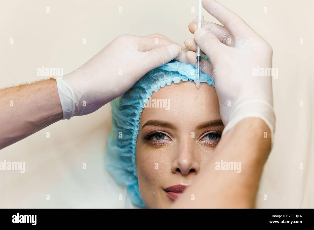 Injection in forehead contour plastic for correcting the volume and ...