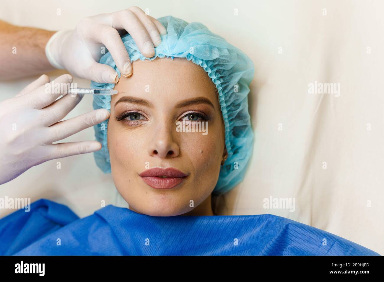 Injection in forehead contour plastic for correcting the volume and ...