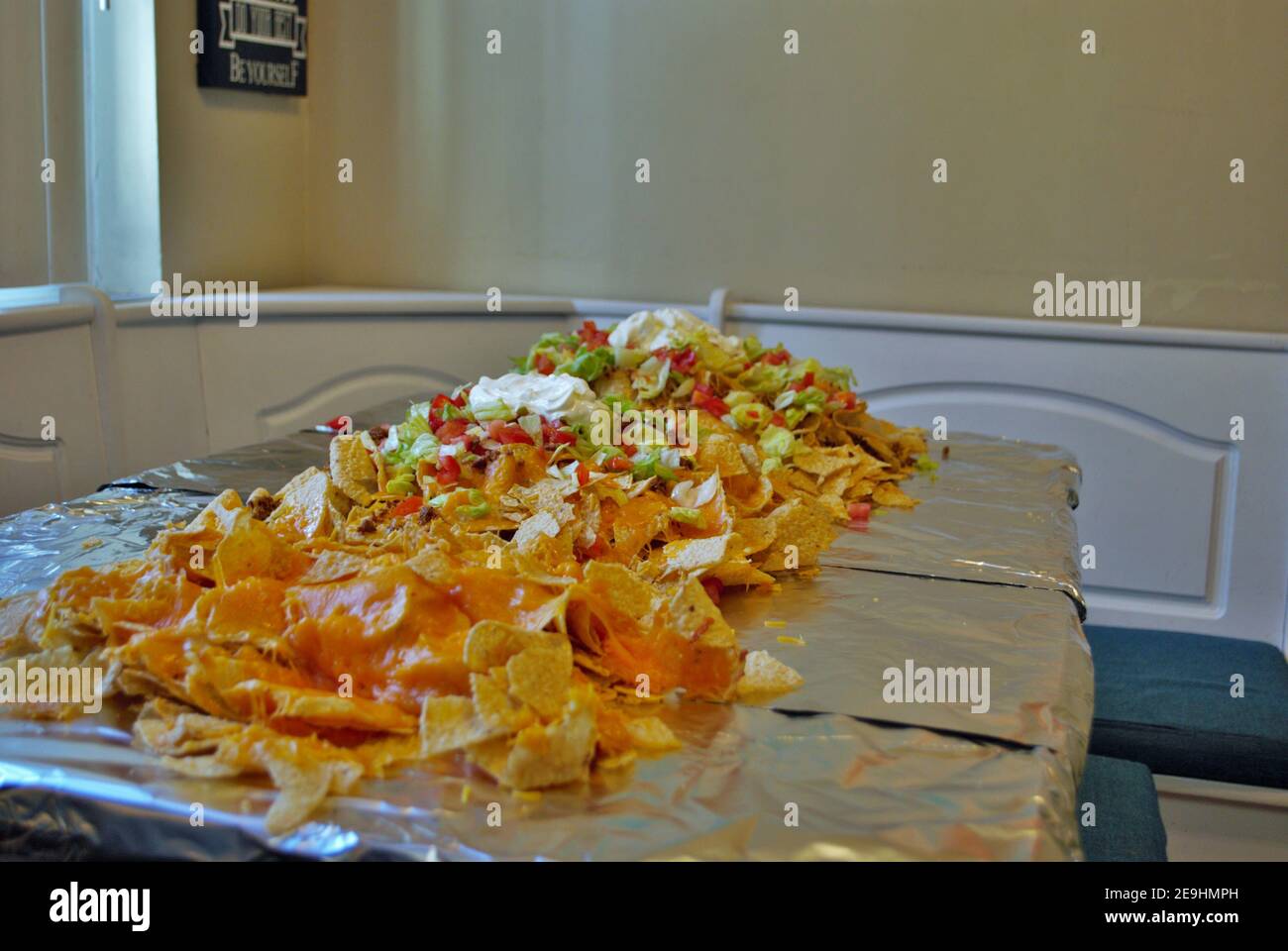 Nacho table kitchen table wrapped in aluminum foil and covered with ...