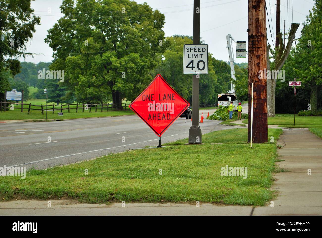 One lane road ahead construction sign on the side of a five lane road ...