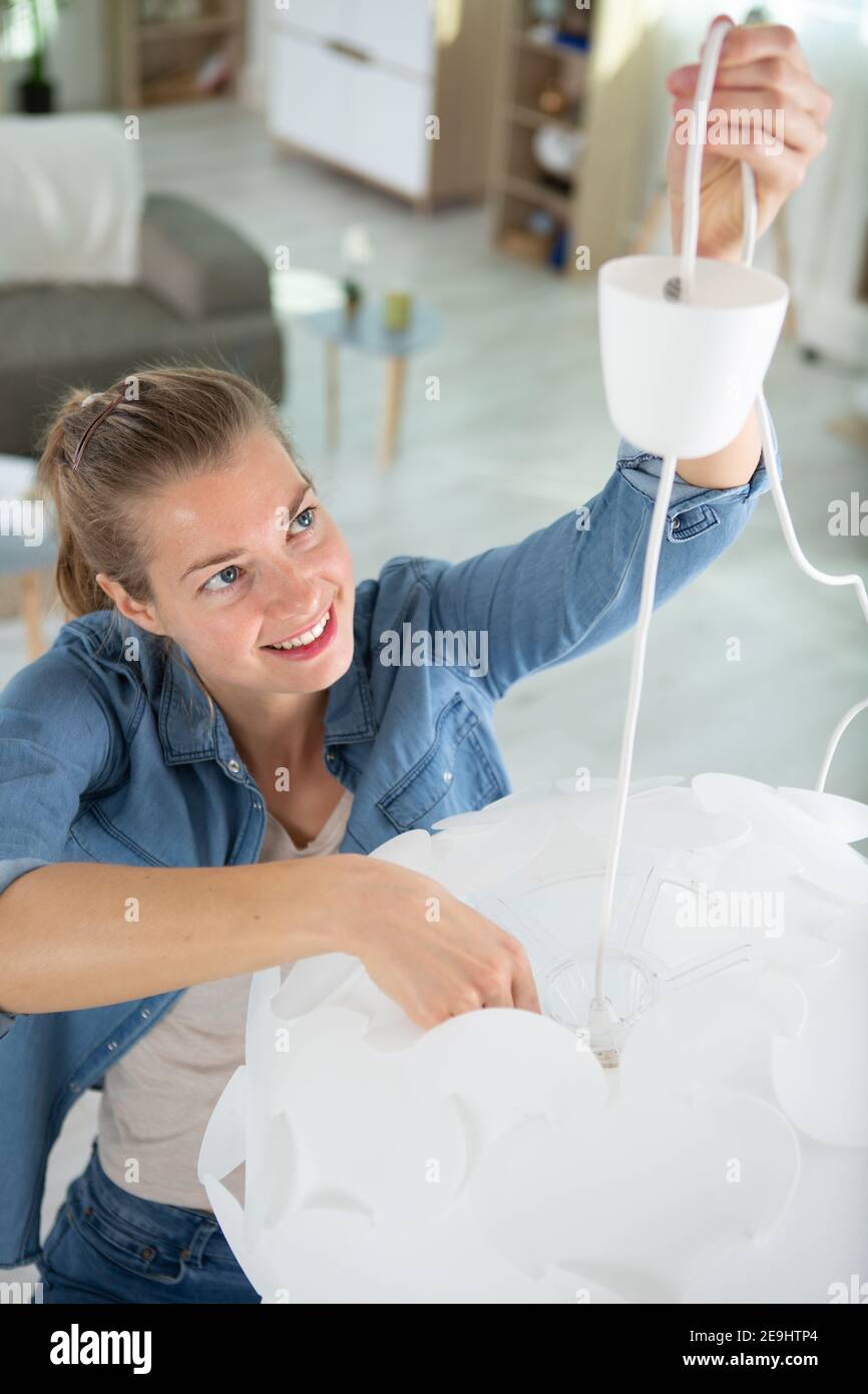 asian woman changing light bulb Stock Photo - Alamy