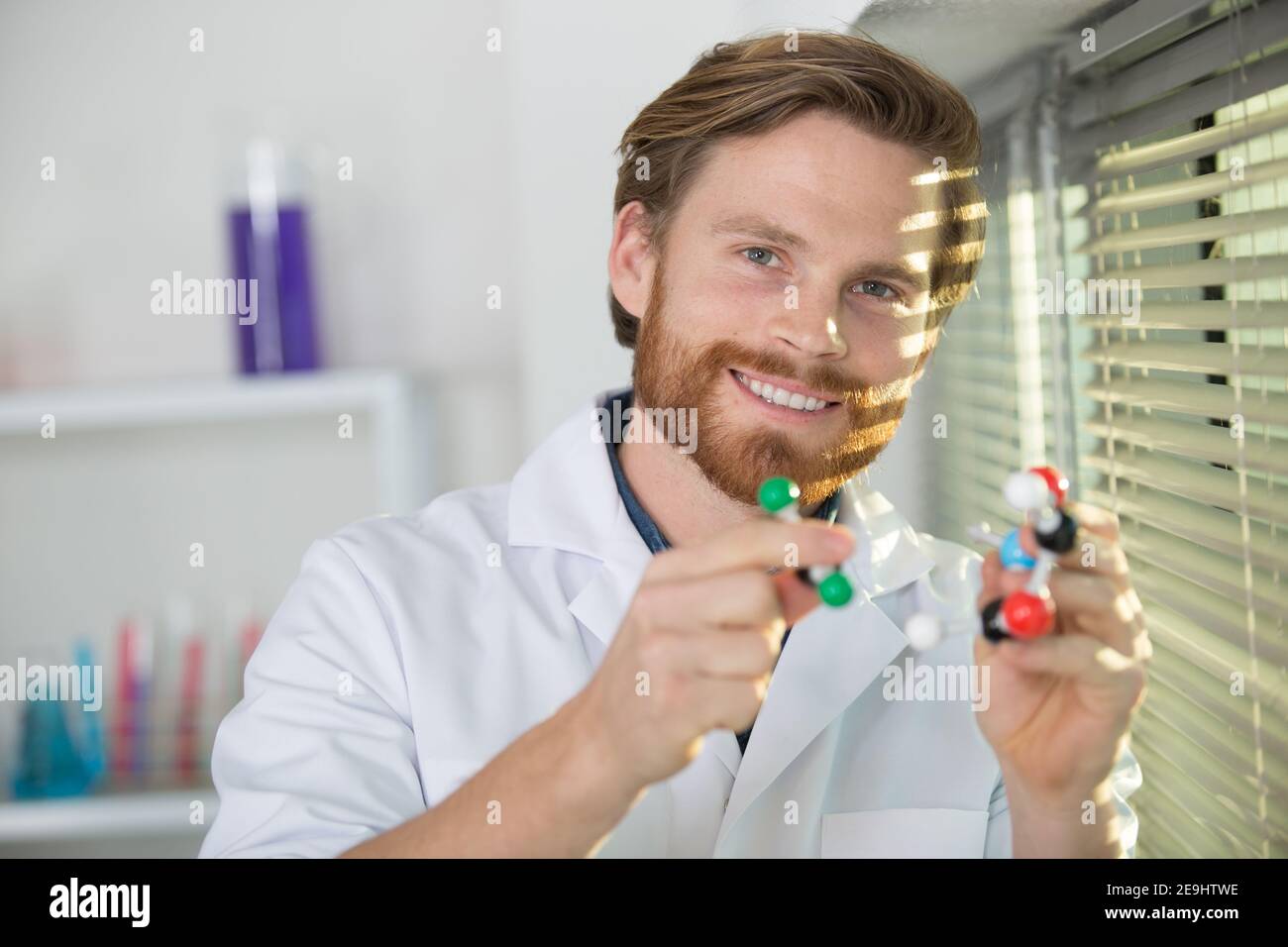 scientist holding molecular model Stock Photo - Alamy