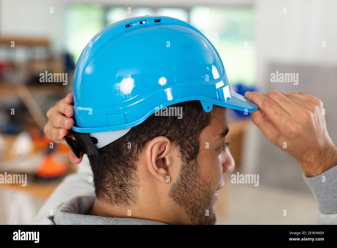 rear view of male builder construction worker wearing helmet Stock ...