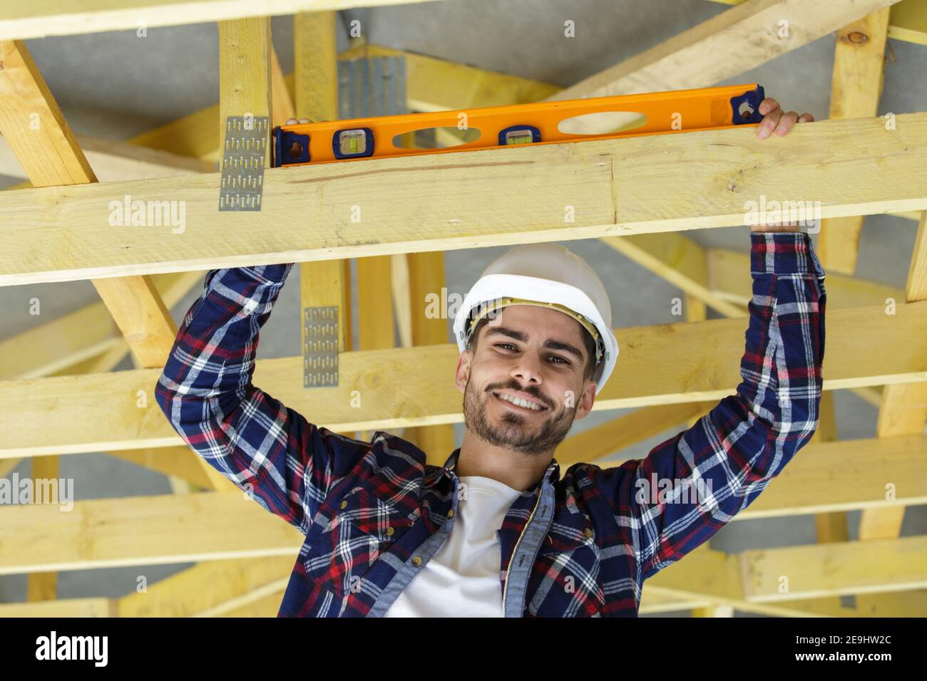 construction worker check the level of wooden frame Stock Photo - Alamy