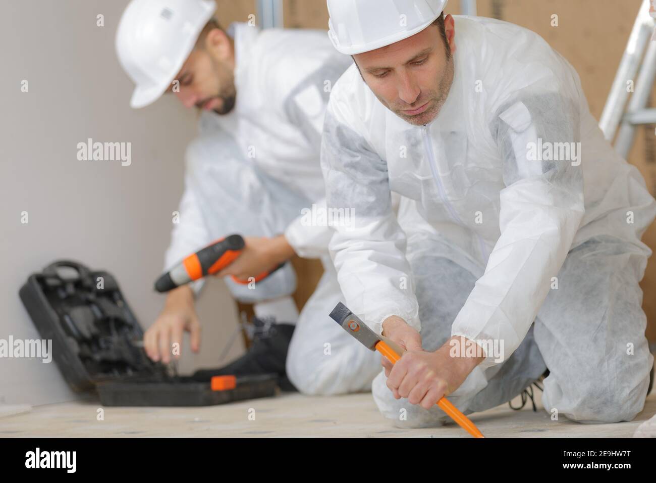builders working on concrete floor base Stock Photo - Alamy