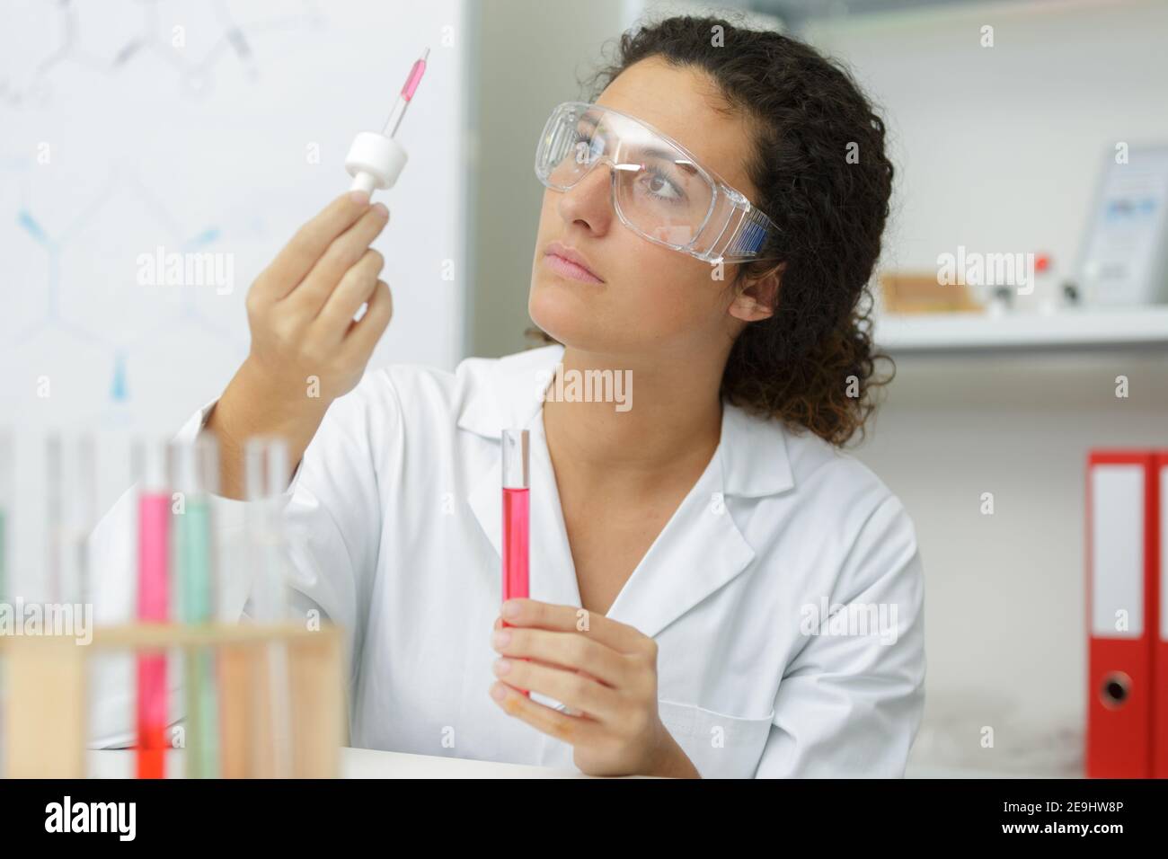woman working with pipettes in a lab Stock Photo - Alamy