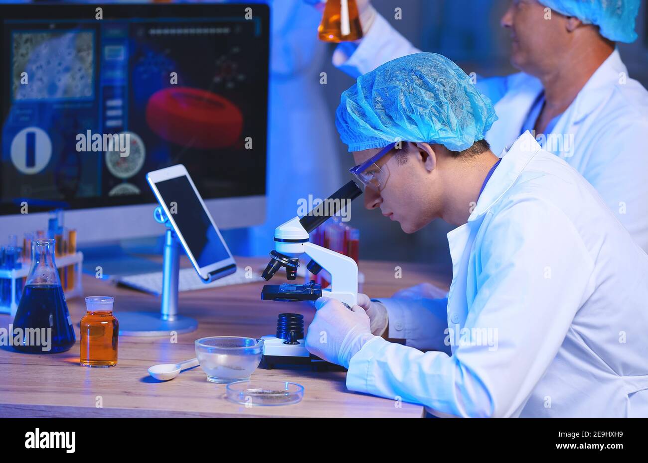 Scientists working with samples in laboratory Stock Photo - Alamy