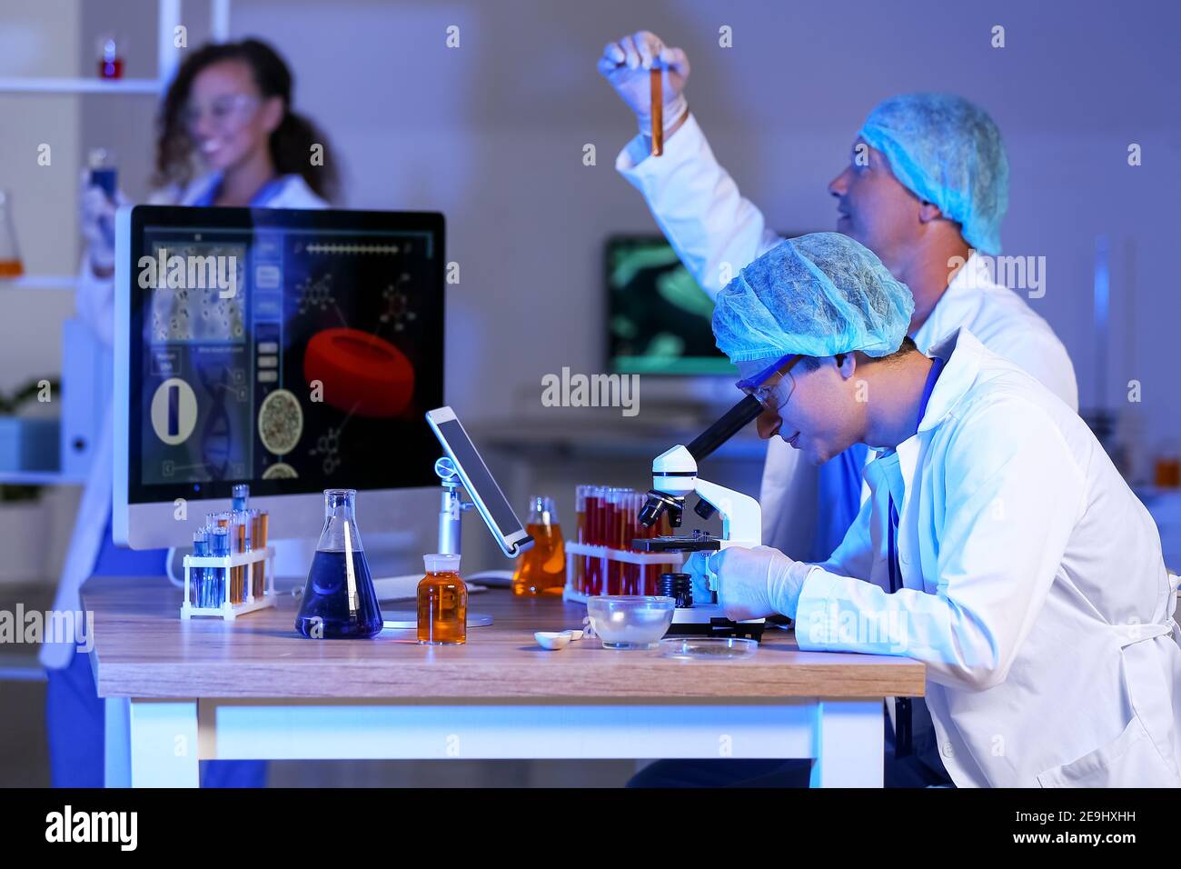 Scientists working with samples in laboratory Stock Photo - Alamy
