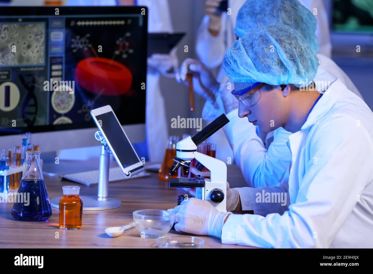 Scientists working with samples in laboratory Stock Photo - Alamy