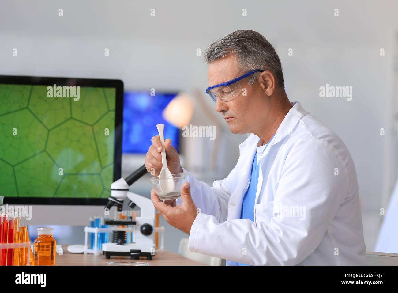 Male scientist working with sample in laboratory Stock Photo - Alamy