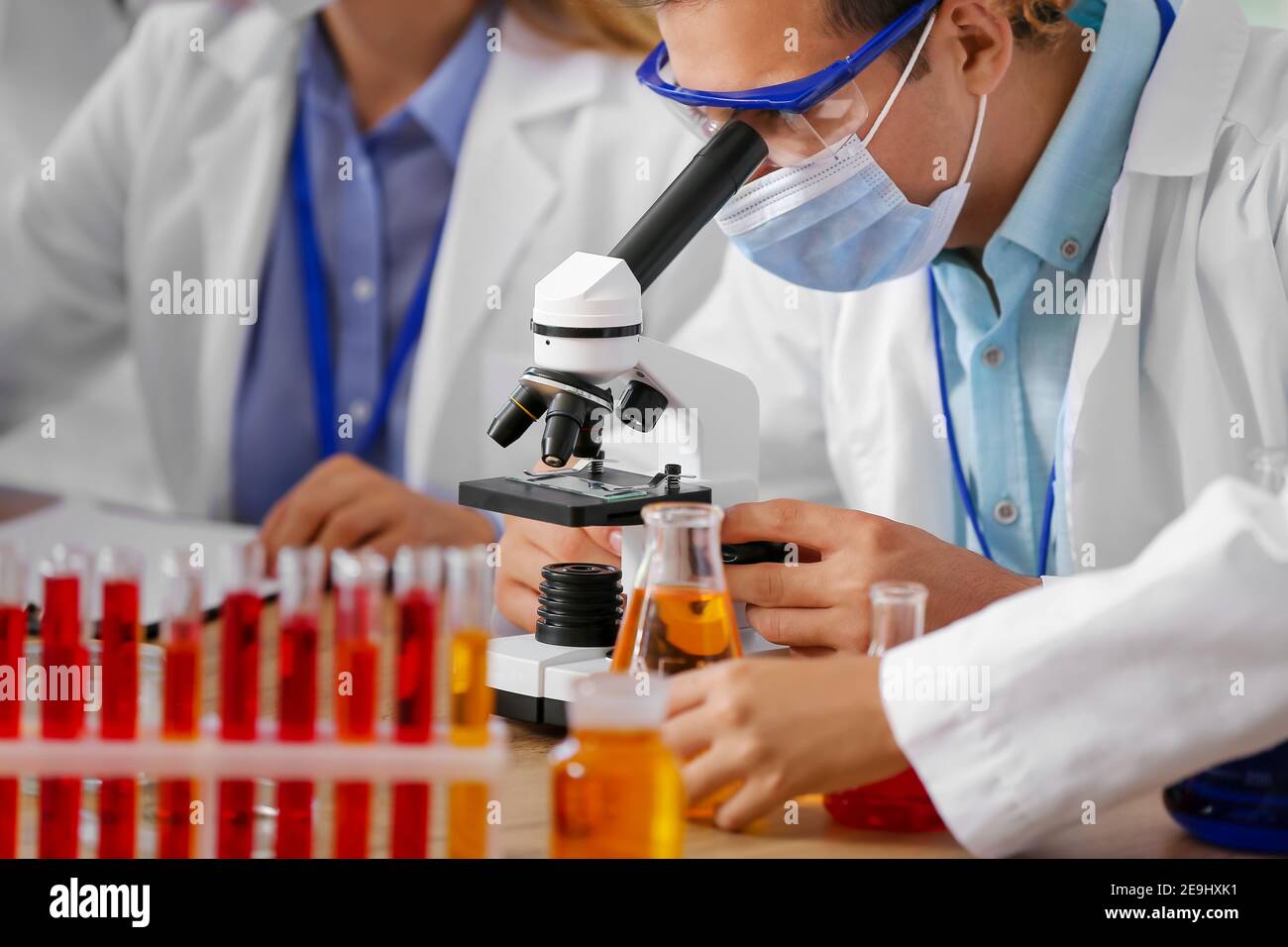 Scientists working with samples in laboratory Stock Photo - Alamy