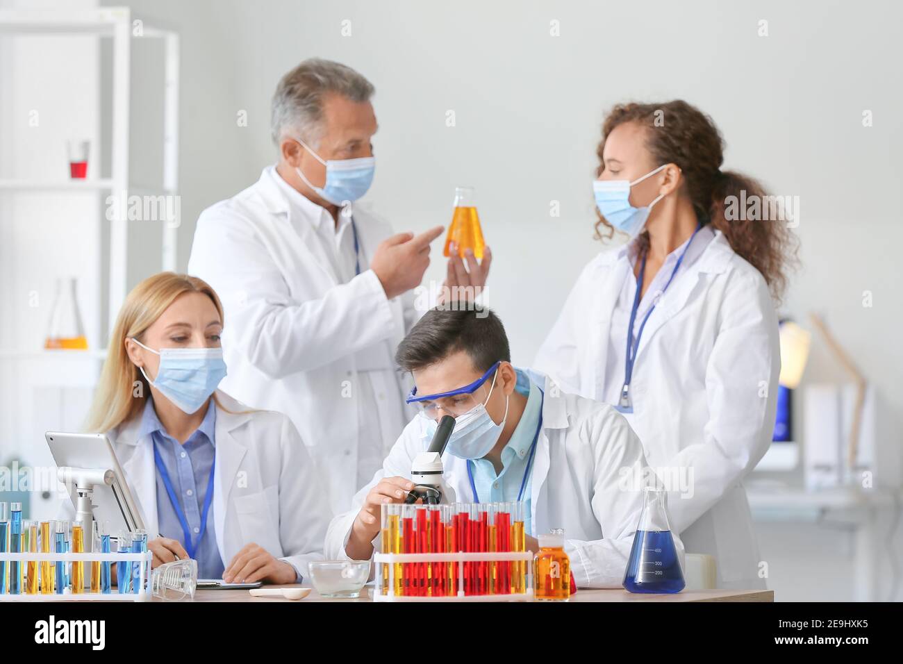 Scientists working with samples in laboratory Stock Photo - Alamy