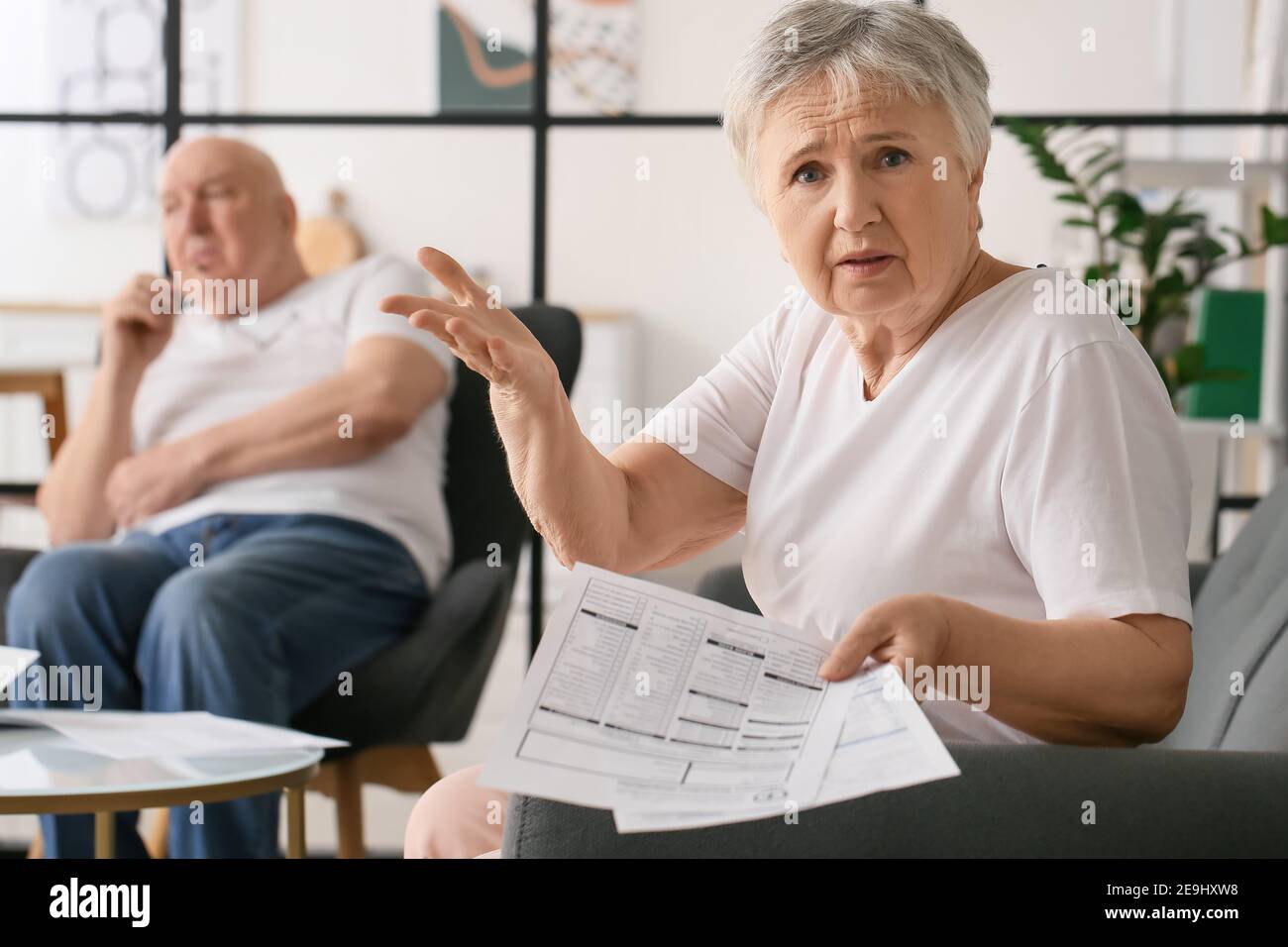 Stressed senior couple in debt at home Stock Photo - Alamy