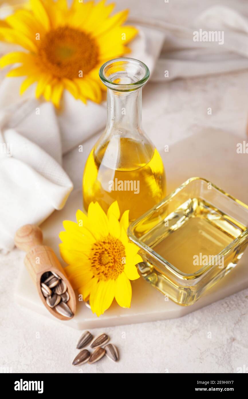Composition with sunflower oil on light background Stock Photo - Alamy