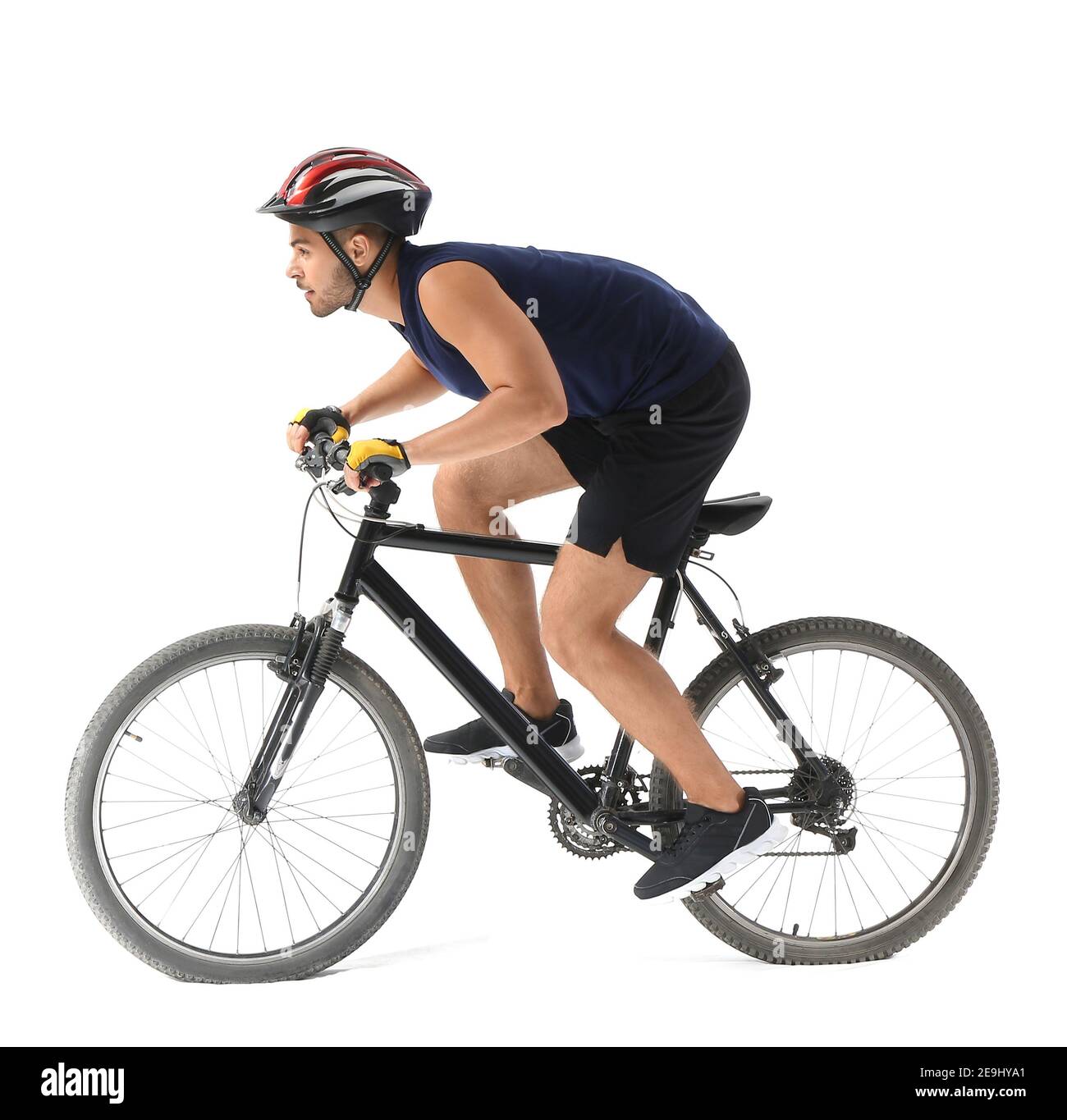 Male cyclist riding bicycle on white background Stock Photo - Alamy