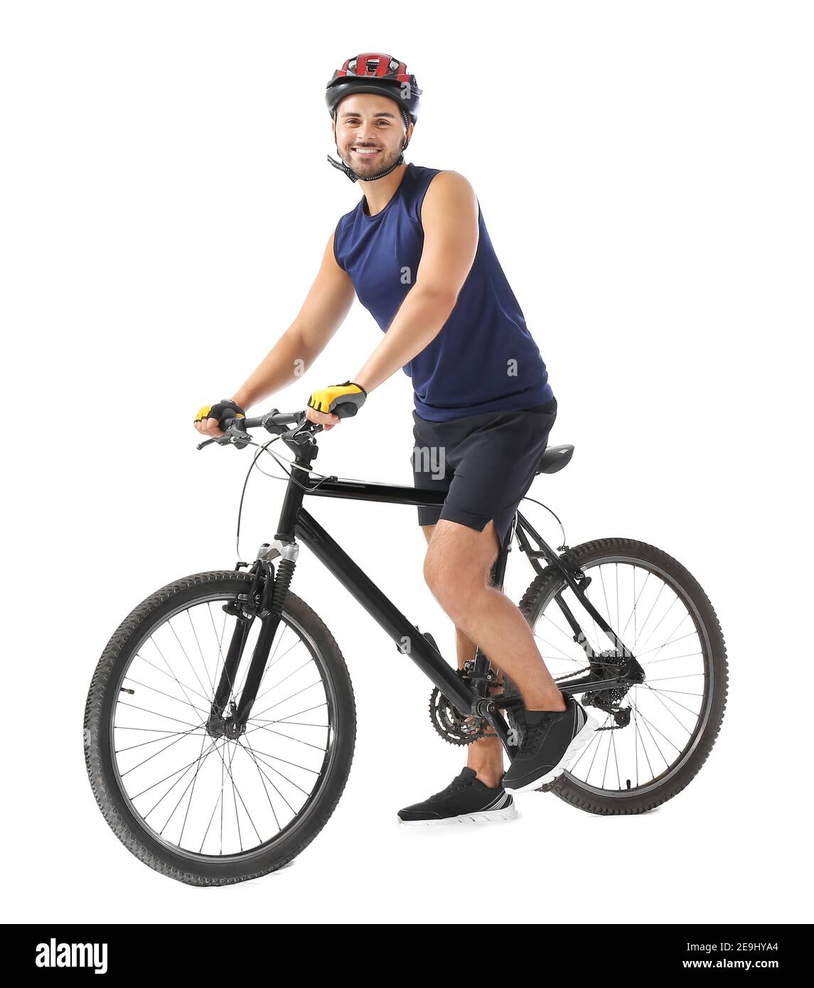 Male cyclist riding bicycle on white background Stock Photo - Alamy