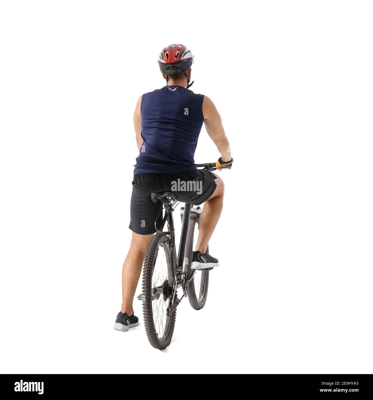 Male cyclist riding bicycle on white background Stock Photo - Alamy