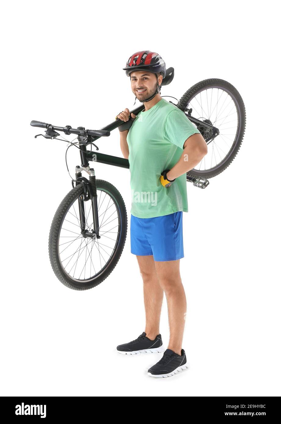 Male cyclist with bicycle on white background Stock Photo - Alamy