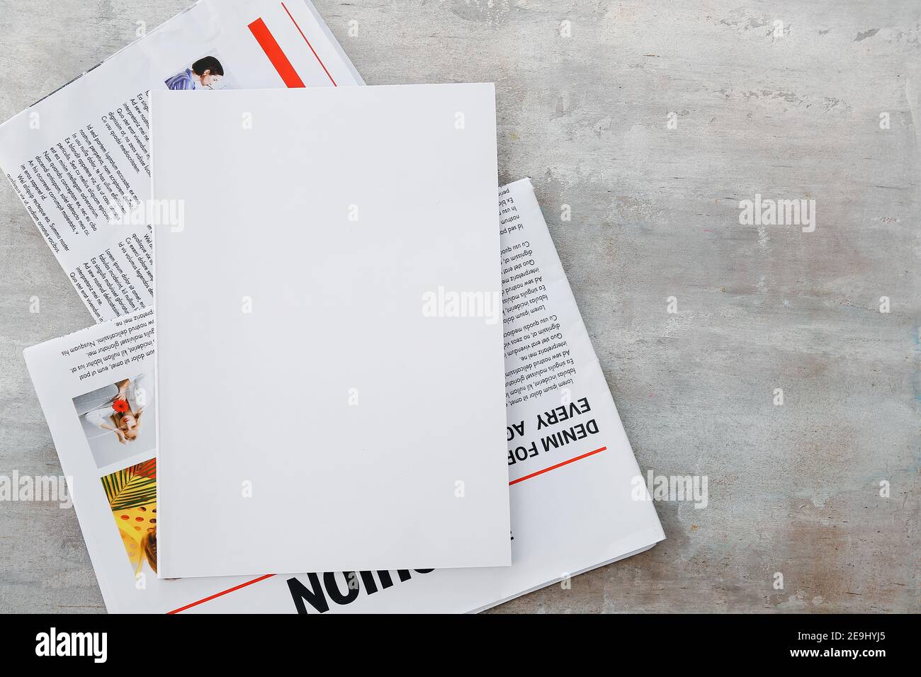 Blank magazine and newspaper on grunge background Stock Photo - Alamy