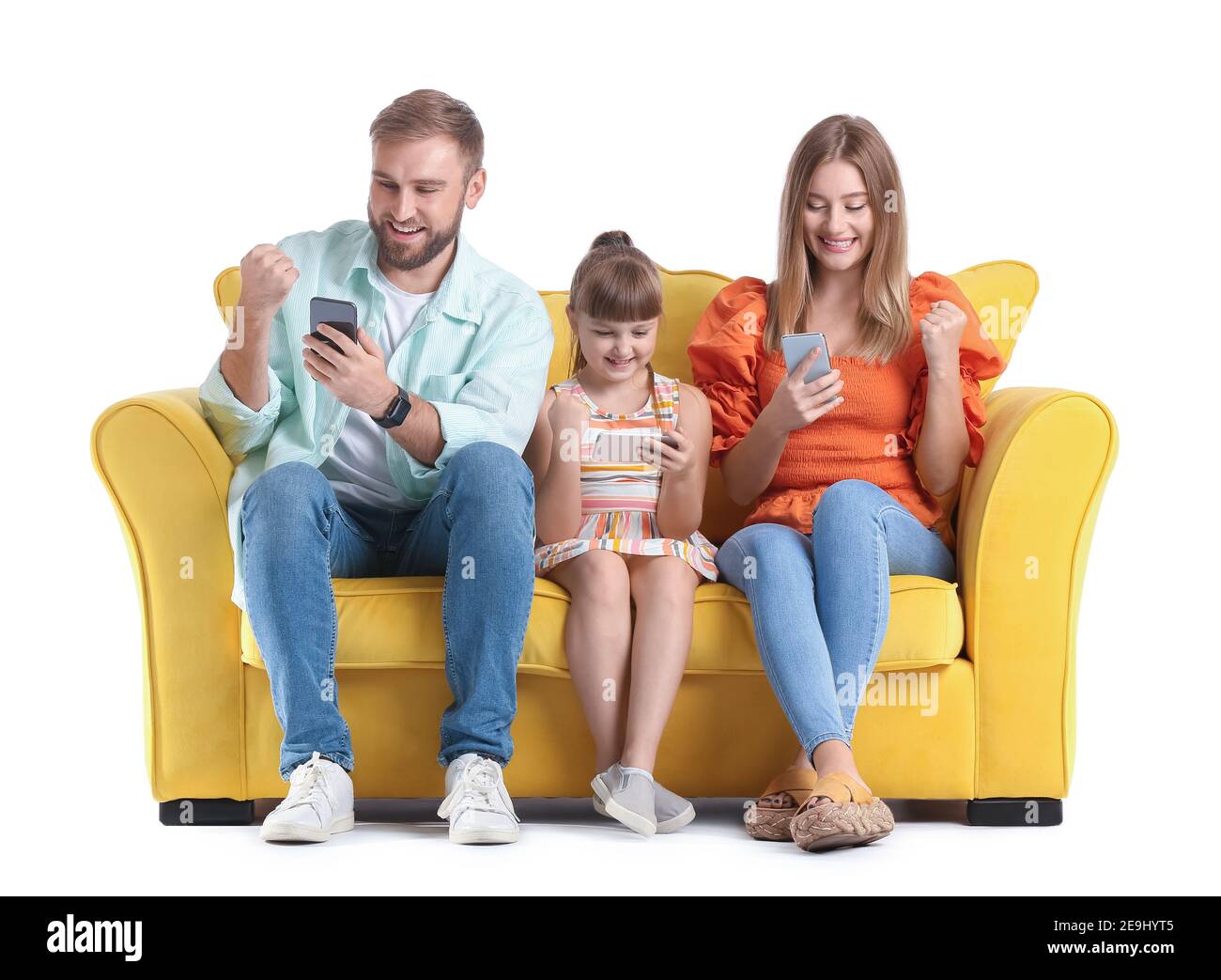 Happy family with mobile phones on sofa against white background Stock ...