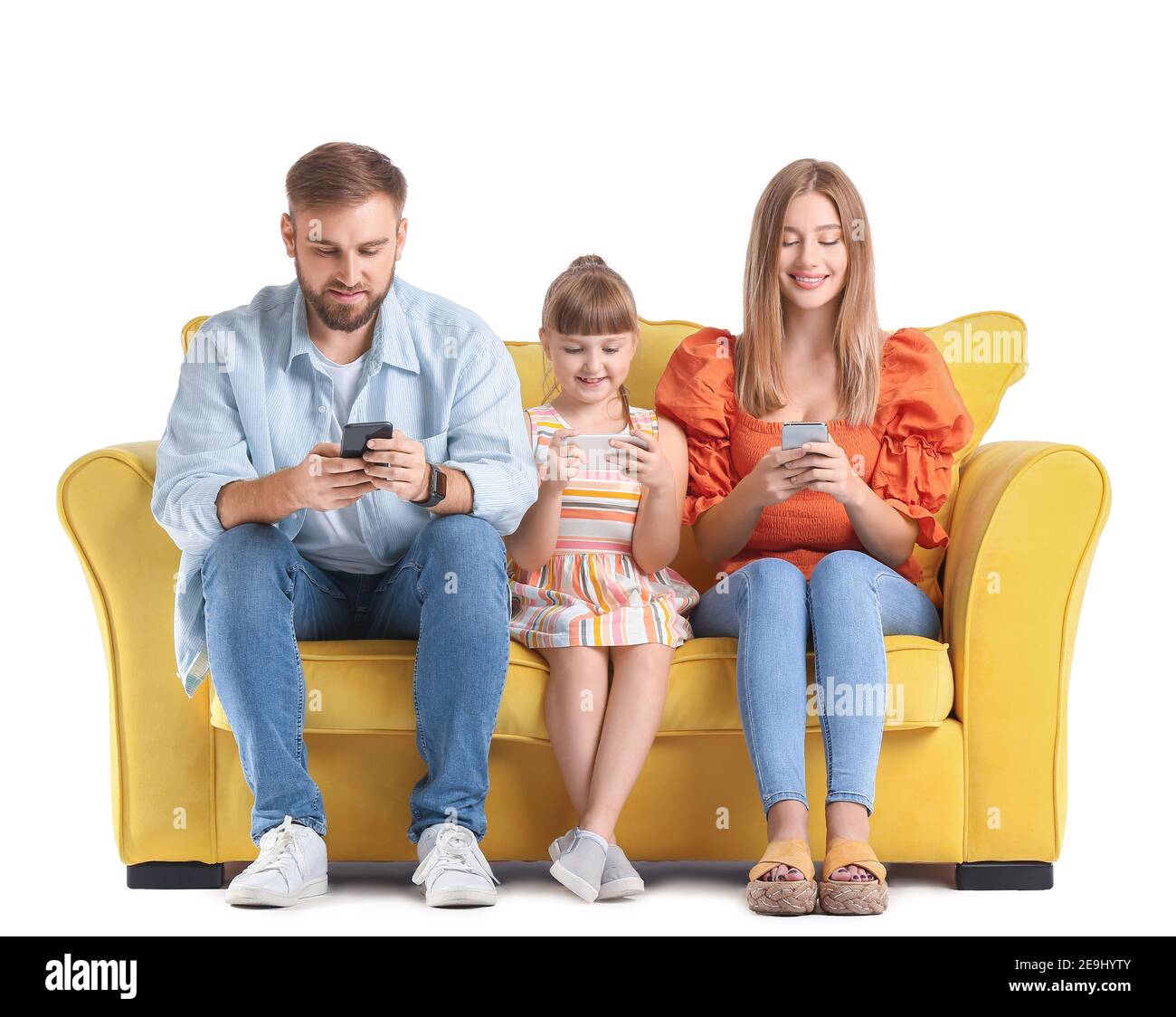 Happy family with mobile phones on sofa against white background Stock ...