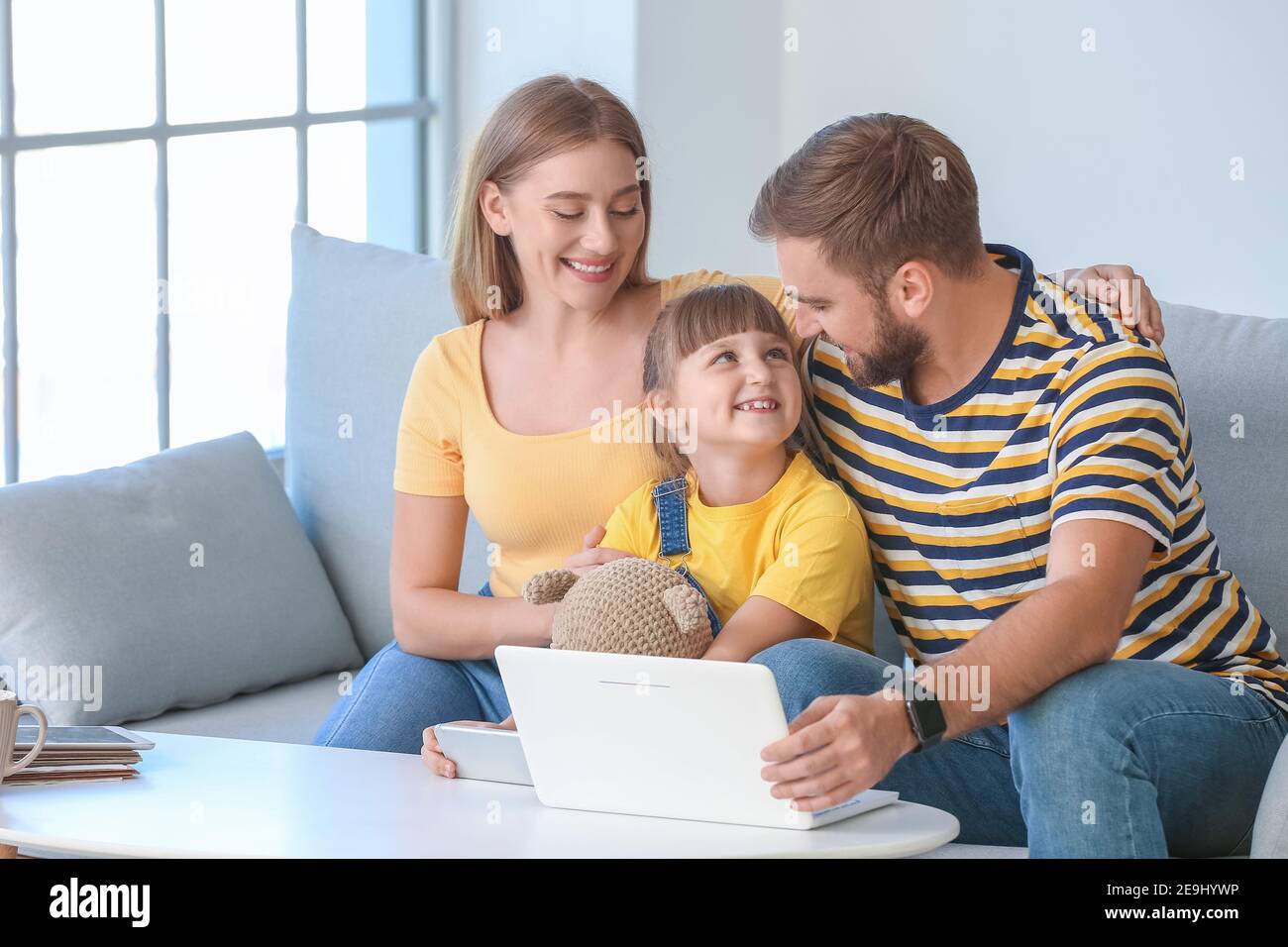 Happy family with modern devices at home Stock Photo - Alamy