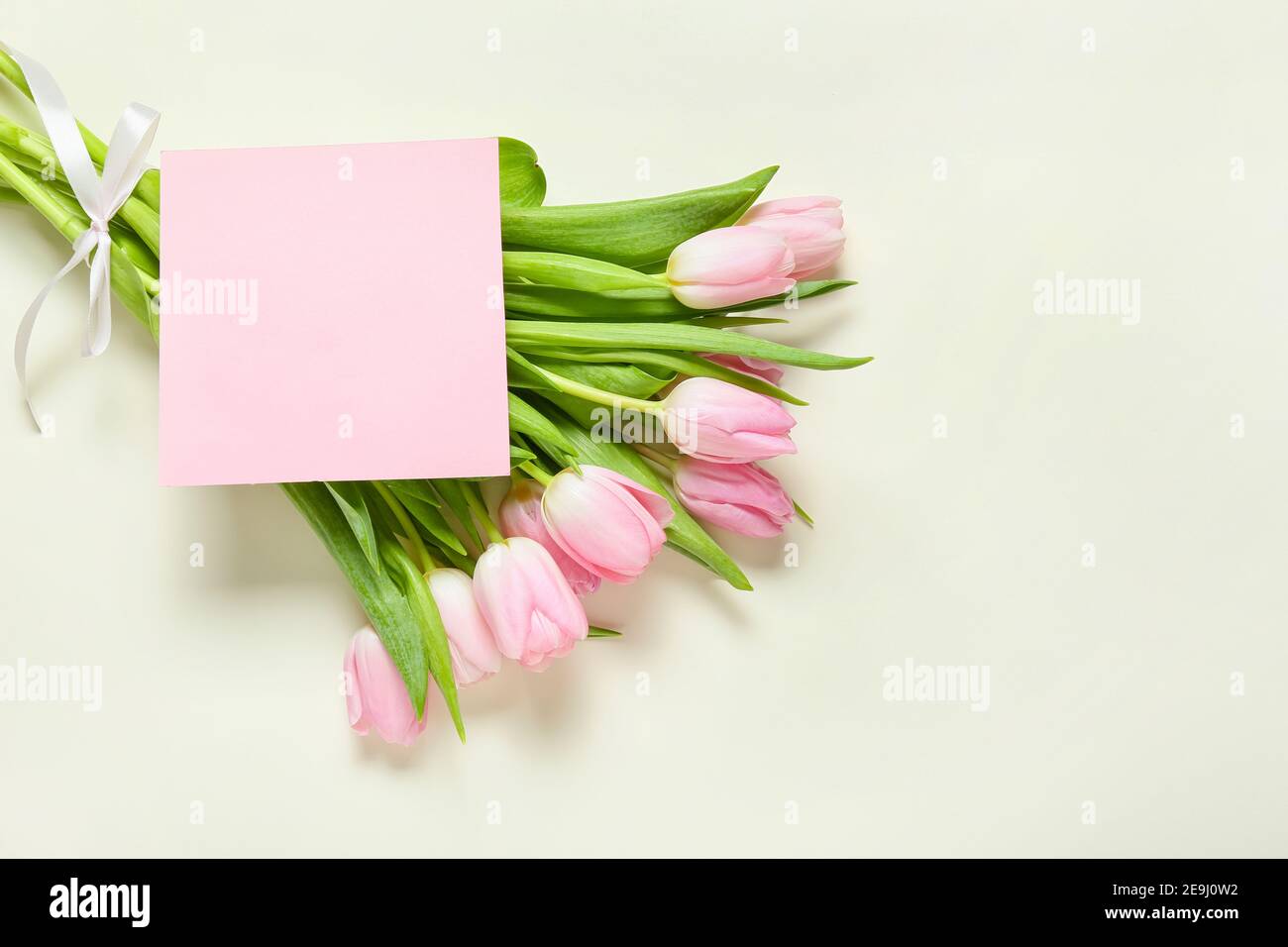 Beautiful flowers and empty card on white background Stock Photo - Alamy