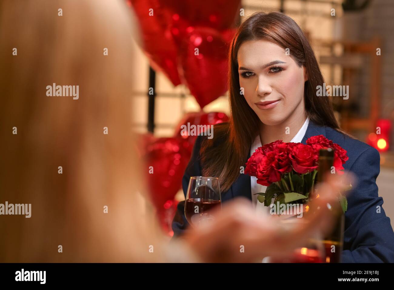 Happy transgender couple celebrating Valentine's Day at home Stock ...