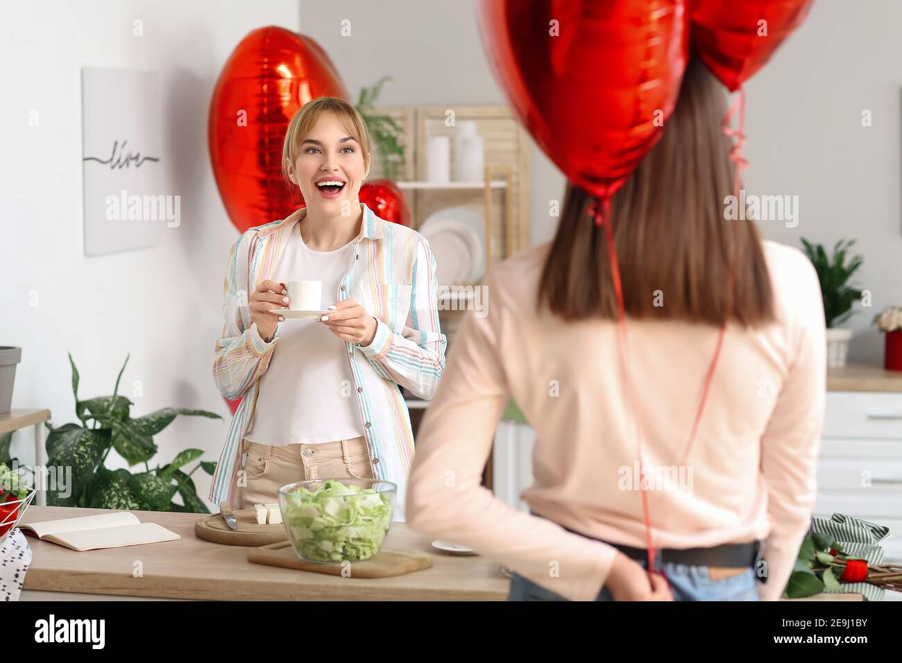 Happy transgender couple celebrating Valentine's Day while cooking ...