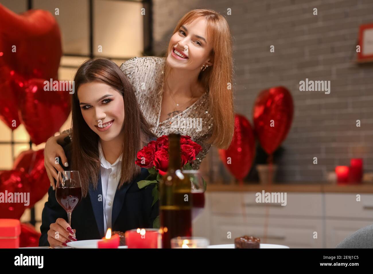 Happy transgender couple celebrating Valentine's Day at home Stock ...