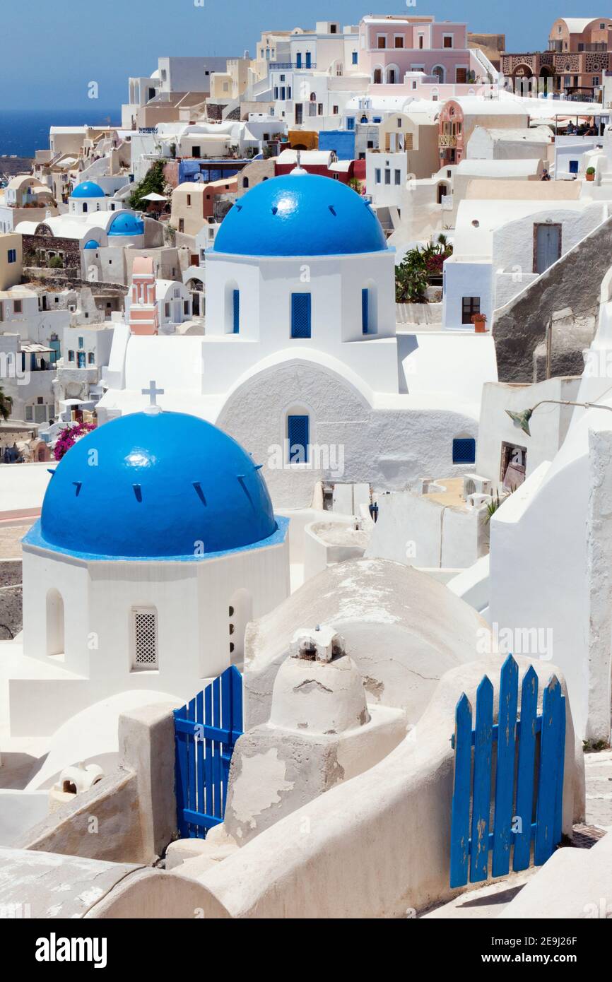 Santorini, Greece Traditional whitewashed houses and churches with blue ...