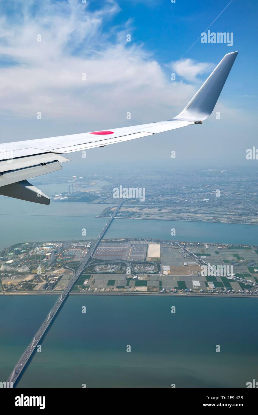 Japanese airplane wing over Nagashima, Nagoya city in Japan. Aerial ...