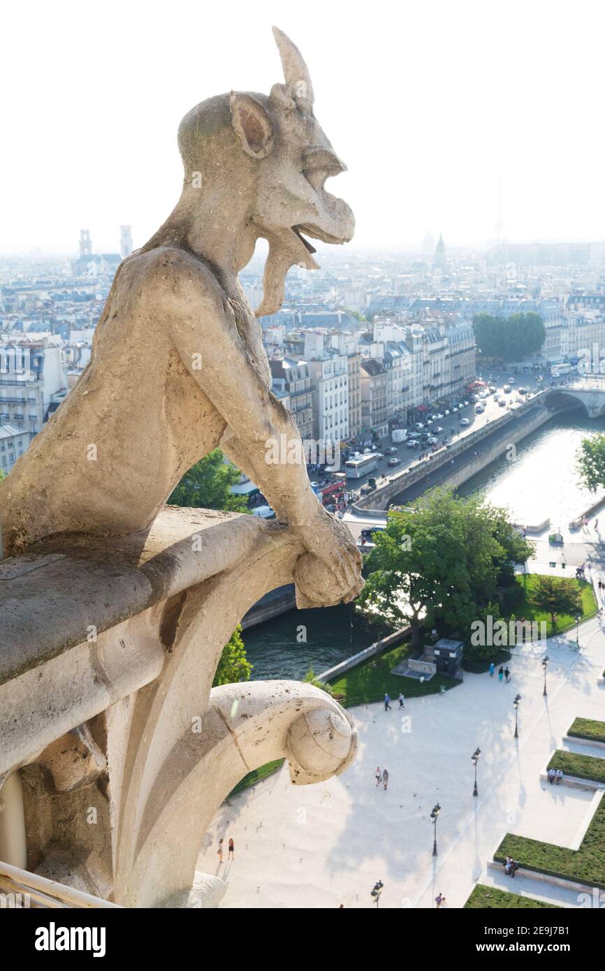Paris, France Goat gargoyle on the Notre Dame Cathedral overlooking the ...