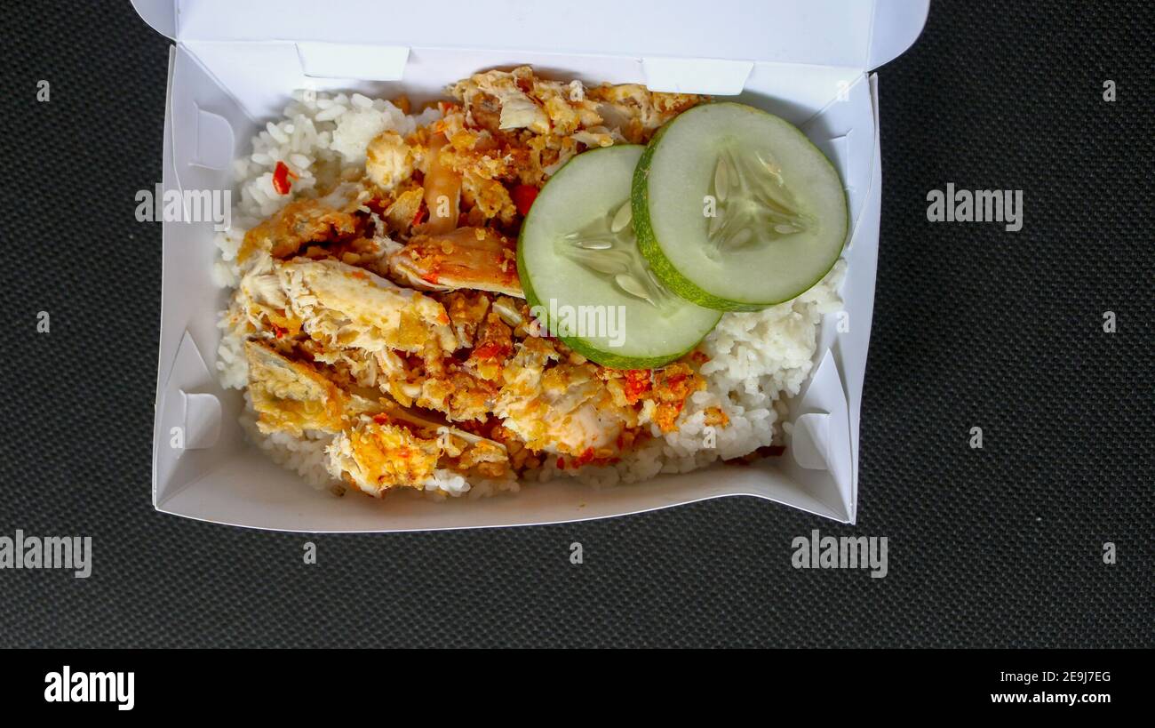 Ayam geprek or Spicy chicken crush with chilli and garlic flavour on ...