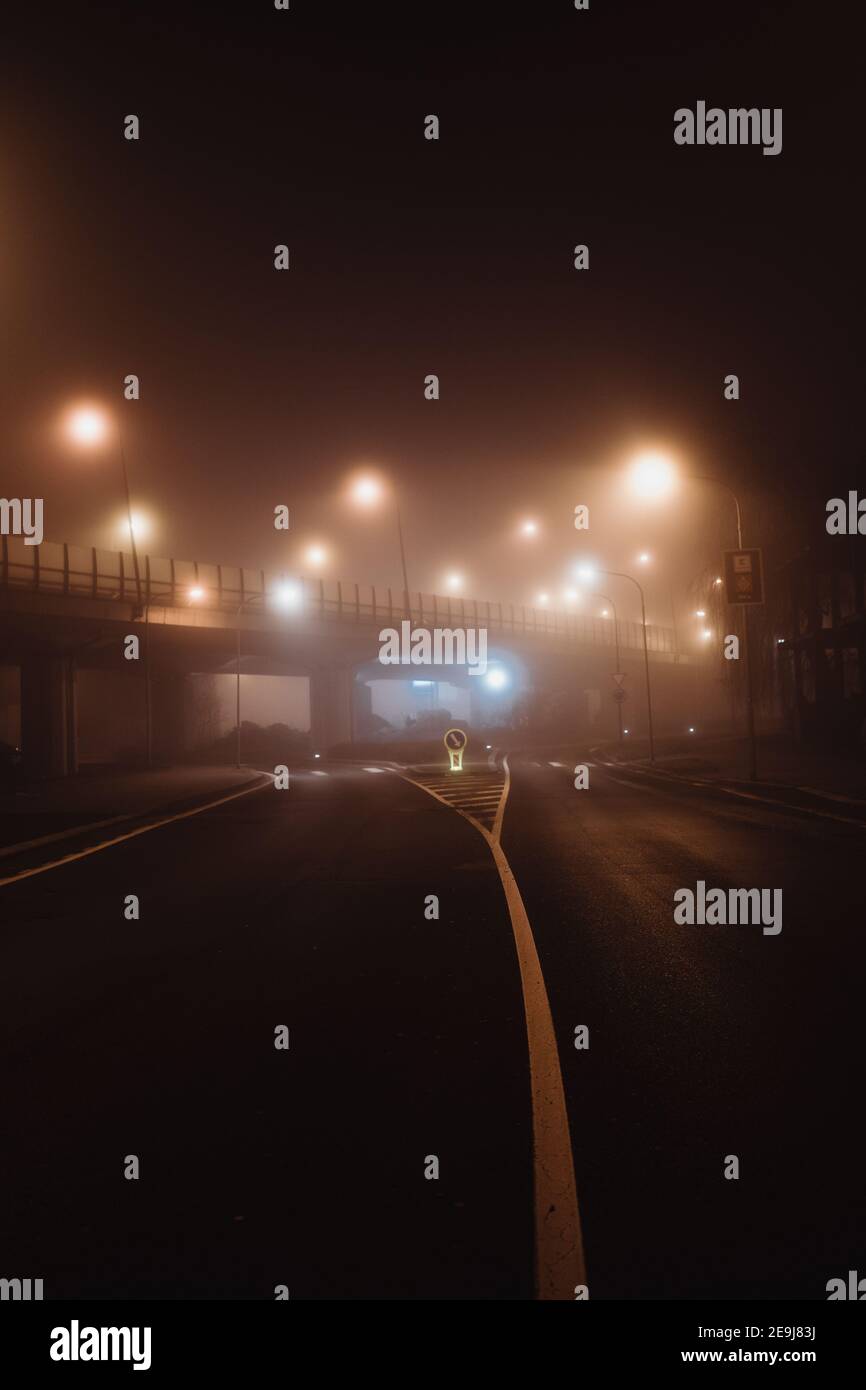 Empty night street with fog Stock Photo - Alamy