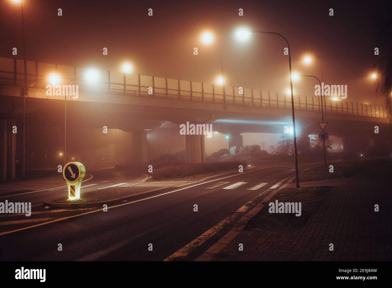 Empty night street with fog Stock Photo - Alamy