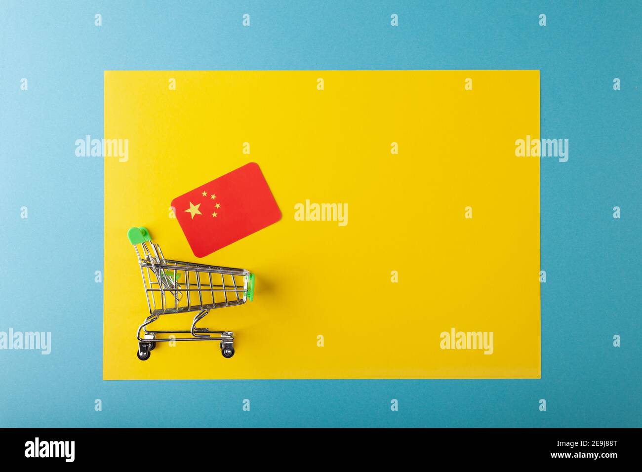 Mini empty supermarket shopping grocery cart, Canada flag on yellow ...