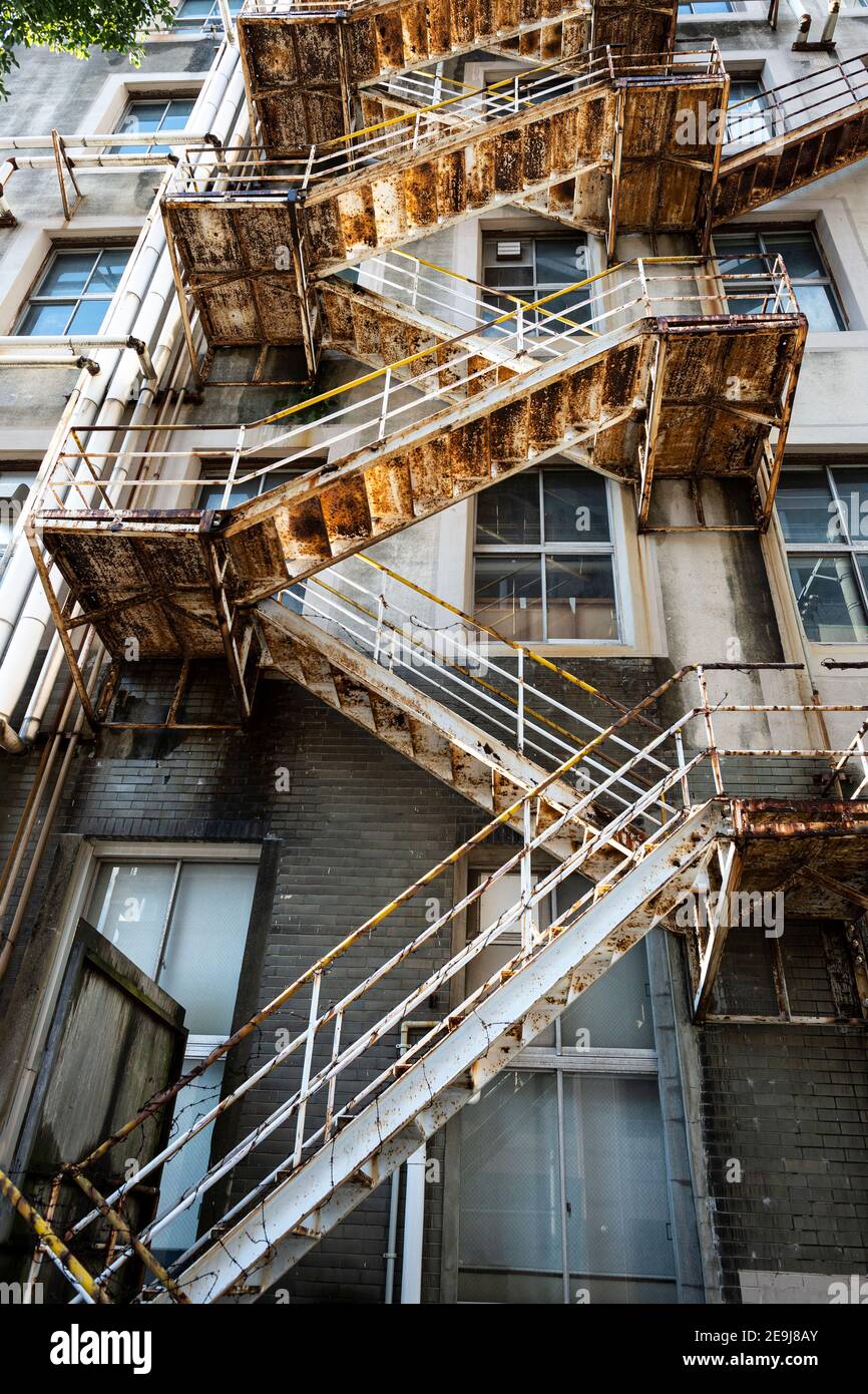 The fire escape of the tall building, very old and very rusted in the ...