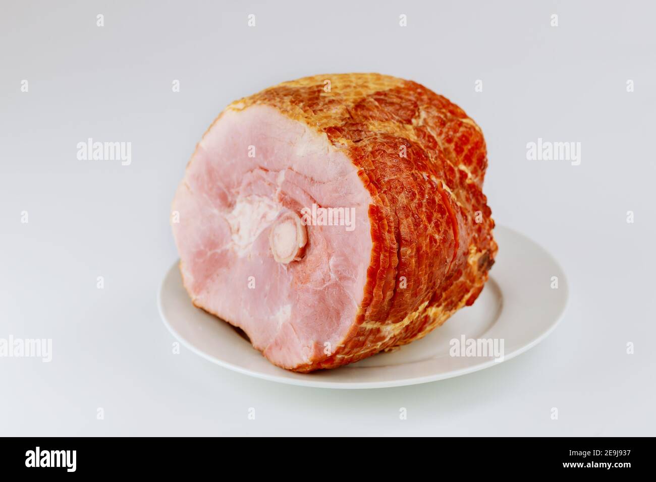 Pork ham spiral sliced isolated on white background. Holiday meal Stock ...
