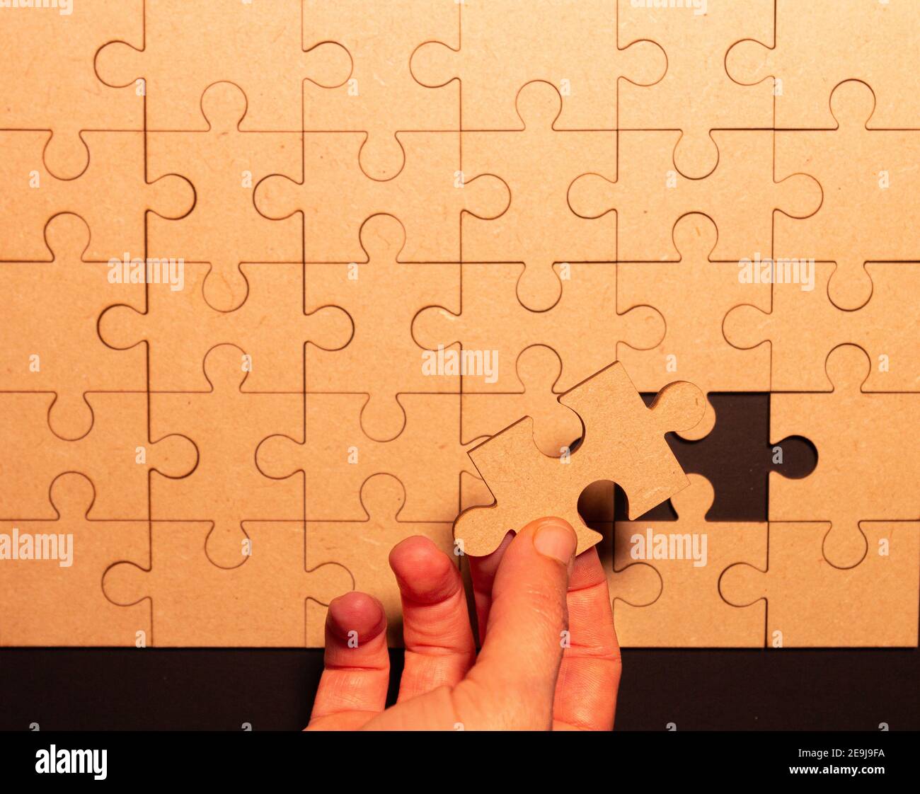 Putting a jigsaw puzzle together hi-res stock photography and images ...