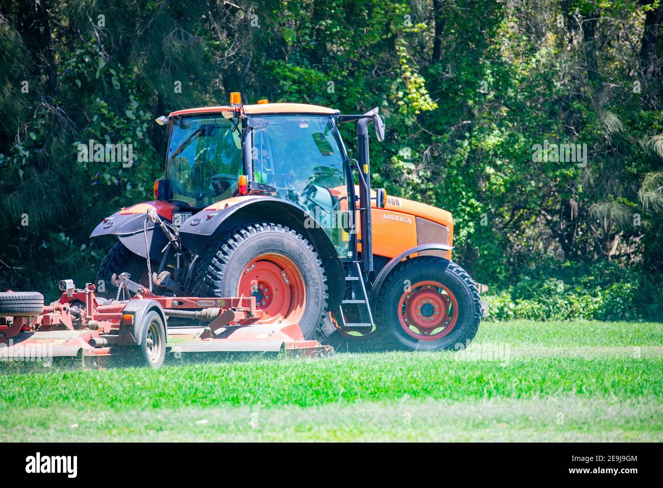 Tractor machine cutting sports field grass in Sydney,NSW,Australia ...
