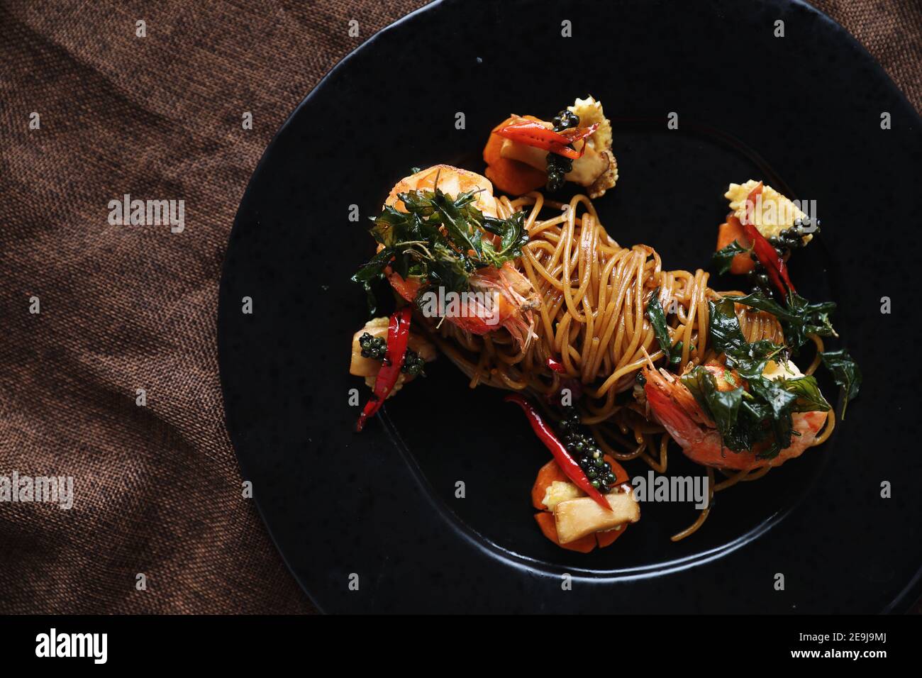 Spaghetti spicy with shrimp , Thai fusion food Stock Photo - Alamy
