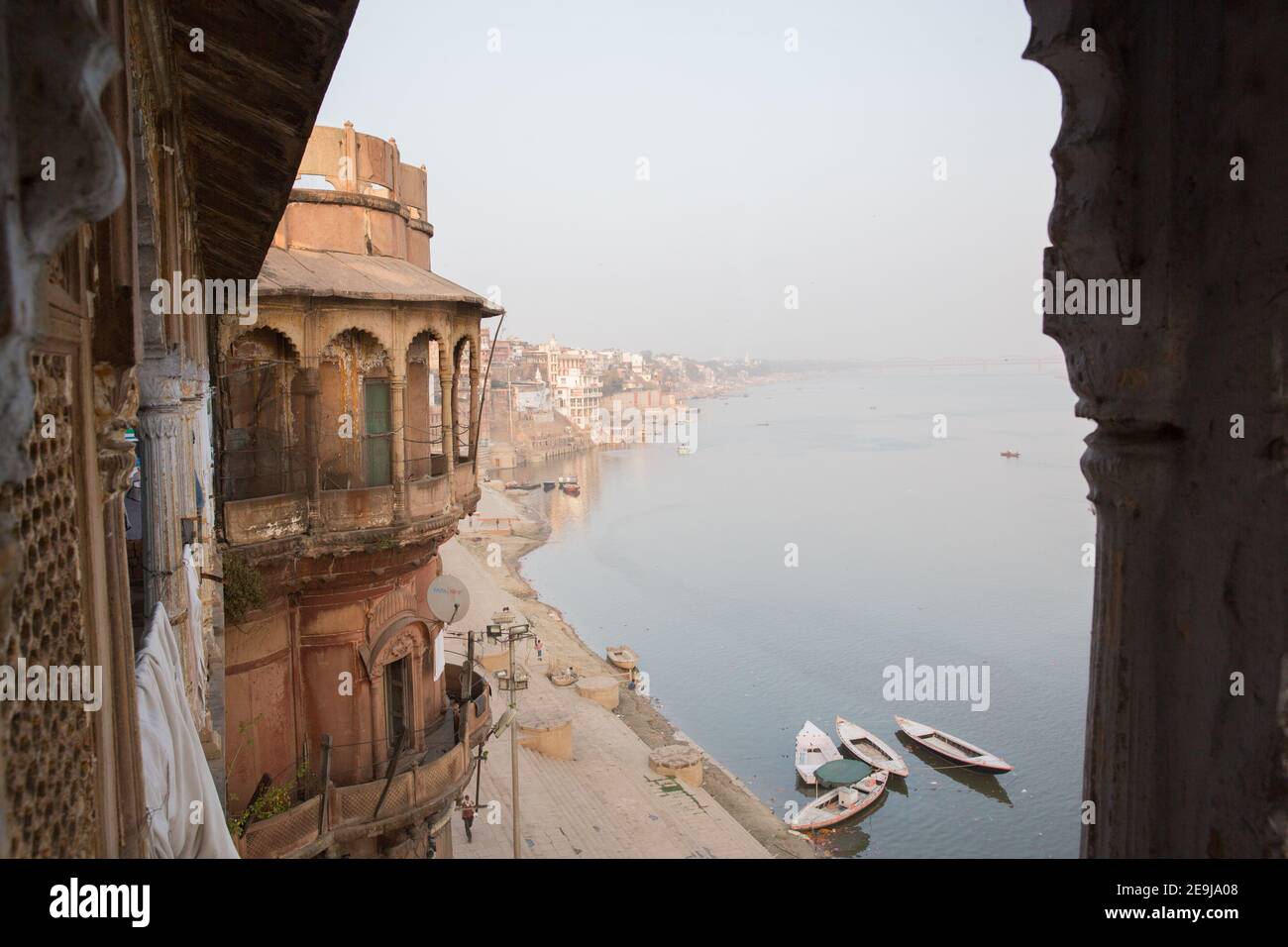 View of the Ganges River through a traditional window in the Old City ...