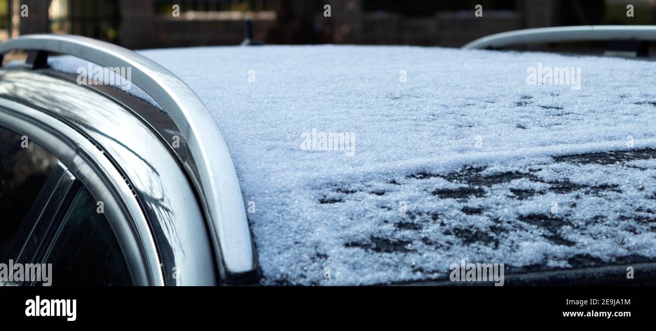 Snow on the roof of the car. The car is covered in ice and snow Stock ...