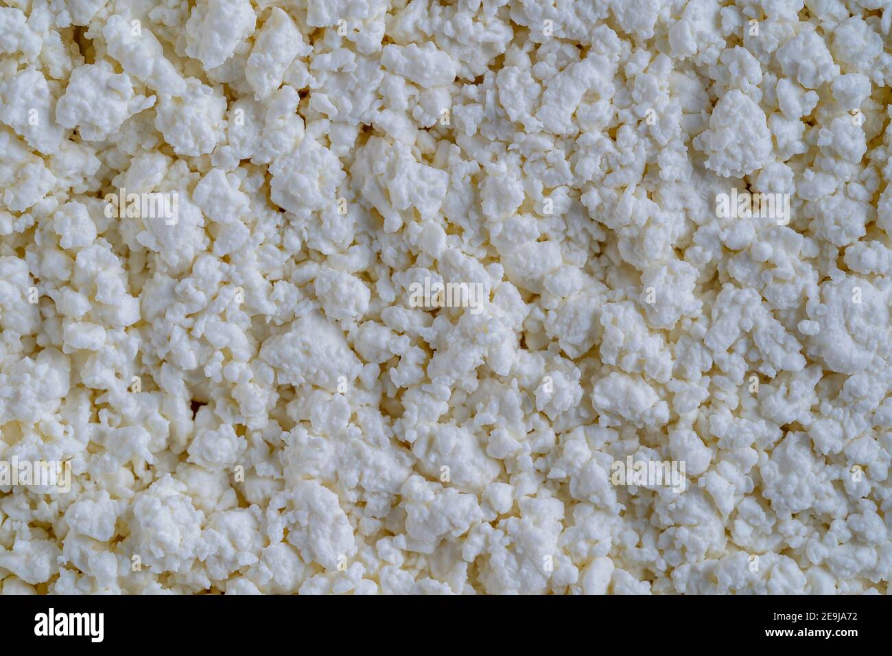 Cottage cheese of background, top view. White grainy texture of dairy ...