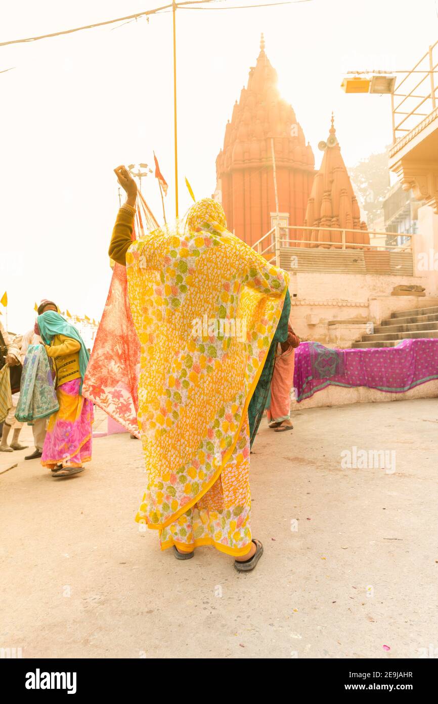 Woman drying her Sari In the Sun Stock Photo - Alamy