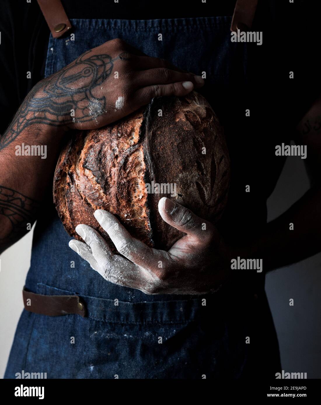 master baker holding his sourdough bread Stock Photo - Alamy